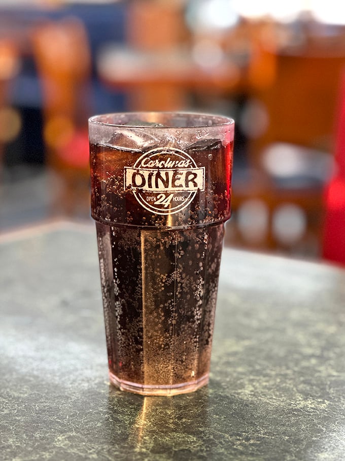 The iconic Carolina's Diner cup holds the elixir of diner life – cola that somehow tastes better here than anywhere else on earth.