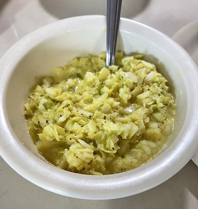 Cole slaw that knows its purpose—to cut through rich barbecue with cool, tangy crunch. This isn't some afterthought side; it's an essential supporting character.