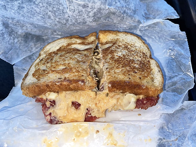 The Reuben sandwich—where corned beef, sauerkraut, and melted cheese perform a harmony so perfect it deserves its own Broadway show.
