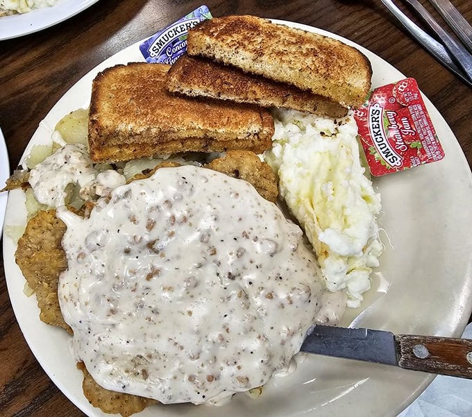 Country fried steak with gravy so good you'll contemplate drinking it – comfort food that hugs you from the inside out.