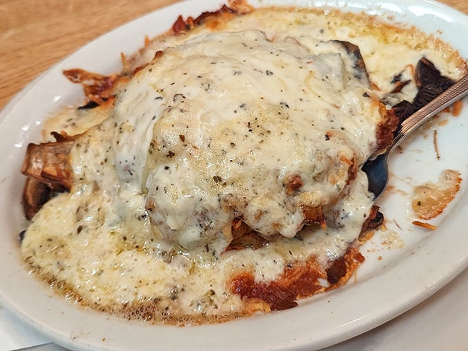 This isn't just cheese – it's a molten masterpiece that transforms whatever lies beneath into something transcendently delicious.