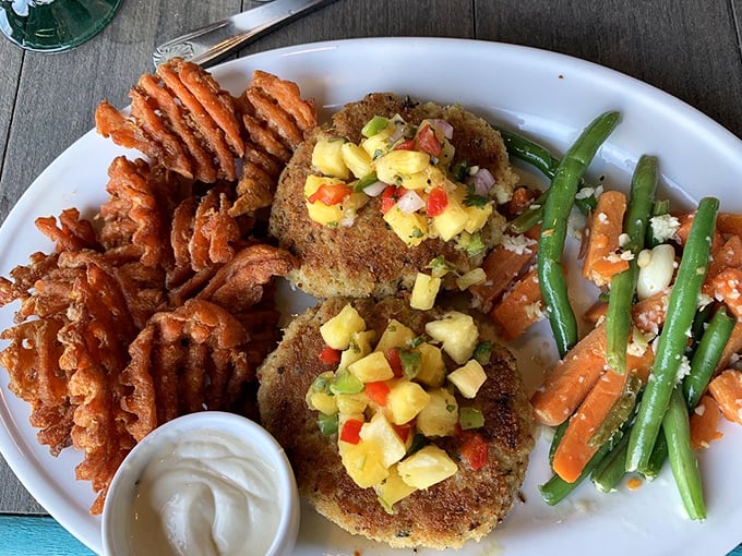 Crab cakes with personality—golden-crusted treasures topped with tropical salsa that makes your taste buds feel like they're on vacation too.