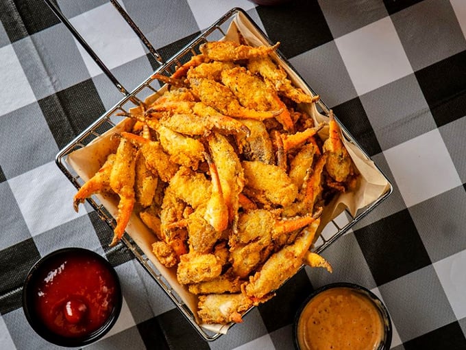 Catfish strips arranged in a wire basket—the kind of presentation that says "we're casual, but we know exactly what we're doing."