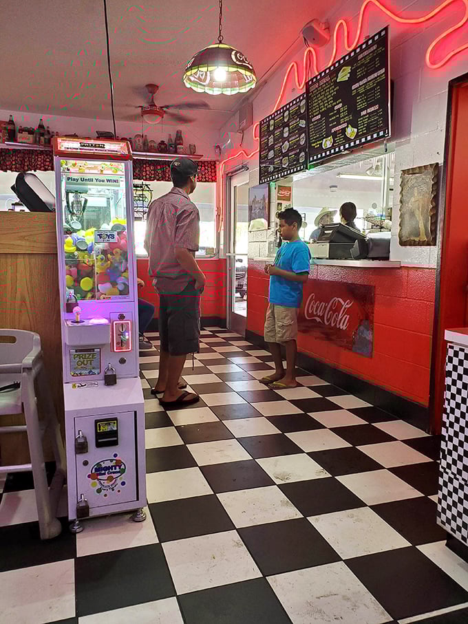 The timeless ritual of ordering at the counter – where anticipation builds with each step closer to burger bliss.