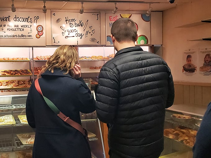 The universal language of anticipation – customers contemplating life's most important question: "How many donuts is too many donuts?"