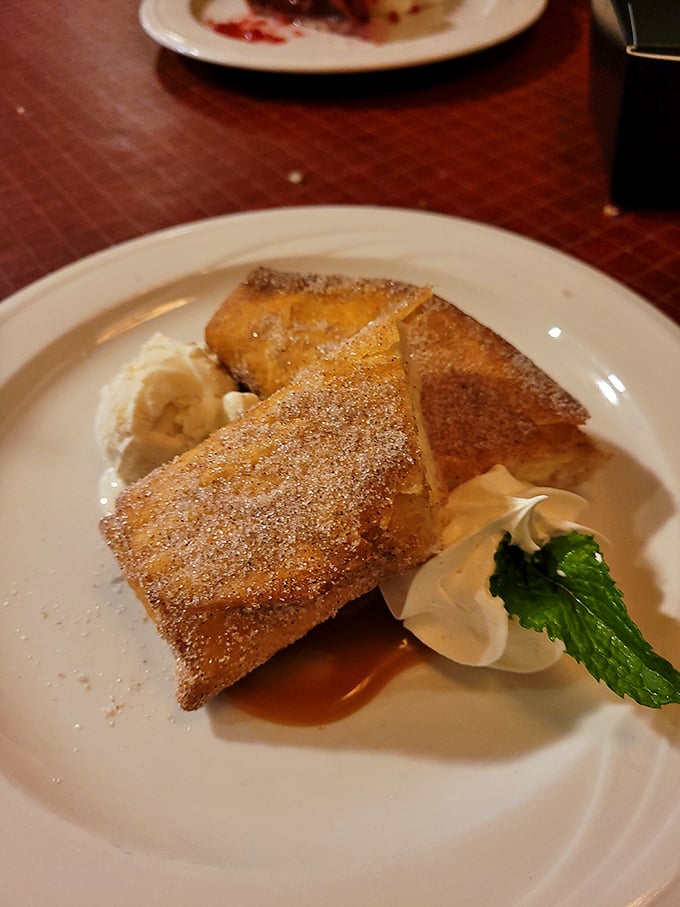 Dessert that defies physics—somehow both light and indulgent, with a dusting of powdered sugar that feels like edible fairy dust.