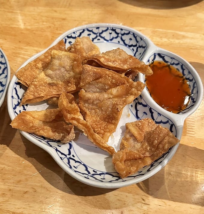 These wontons don't just crunch—they announce themselves with a crispy fanfare that makes everyone at neighboring tables glance over with envy.