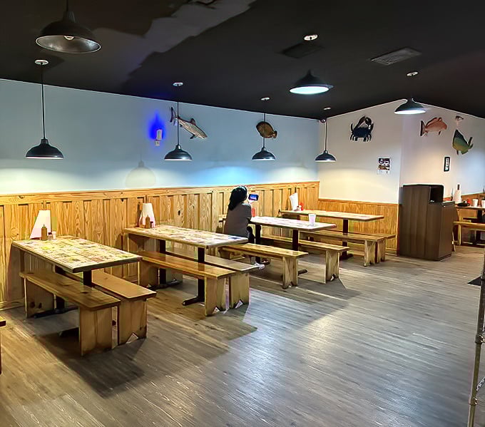 Simple bench seating with fish silhouettes swimming across the walls – casual dining where the focus stays firmly on what's on your plate.