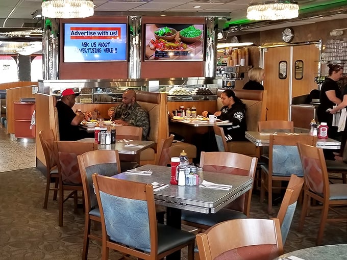 The dining room hums with the energy of regulars and newcomers alike, all united in the universal language of "pass the syrup, please."