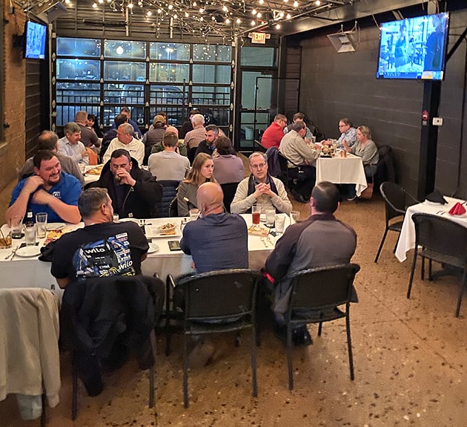 The private dining area buzzes with conversation and clinking glasses – proof that breaking bread together remains humanity's finest social invention.