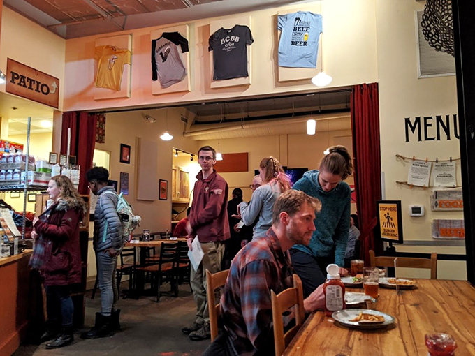 The bustling dining room captures that magical moment when a restaurant becomes more than a place to eat—it becomes a community gathering spot.