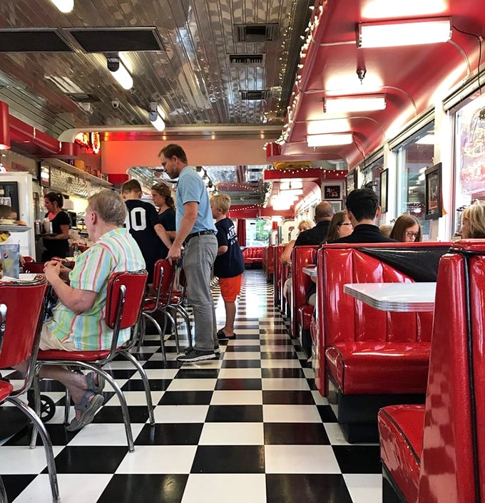 The symphony of a busy diner in full swing—clattering plates, murmured conversations, and the occasional laugh punctuating it all.
