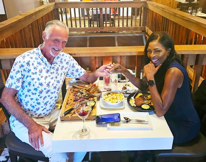 Two diners sharing that universal "this is incredible" look that transcends language—the international sign for "order what they're having."