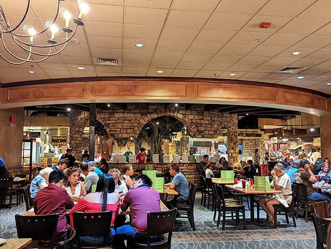 The central dining area reveals Cinzzetti's clever design—a bustling Italian marketplace where the only currency needed is an empty stomach.