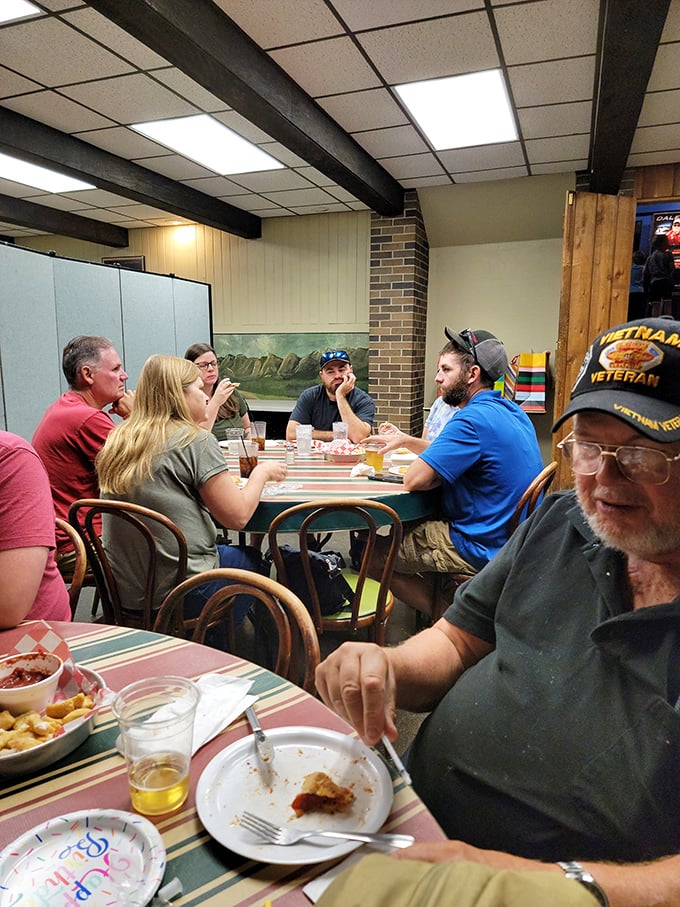 Generations of families gather around these tables, creating memories one slice at a time – the true magic of a neighborhood institution.