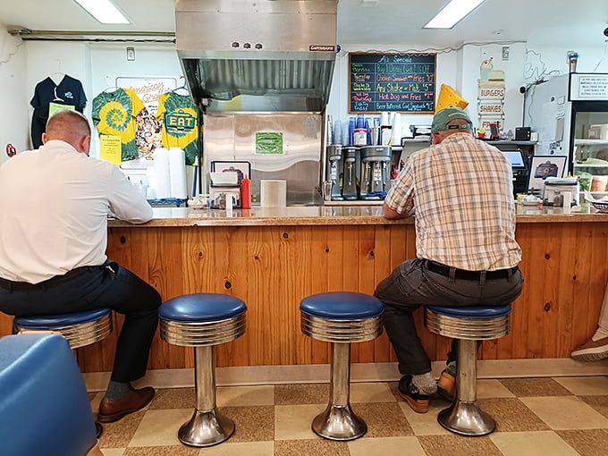 Counter culture at its finest—where strangers become friends over the shared religion of perfectly grilled beef patties.