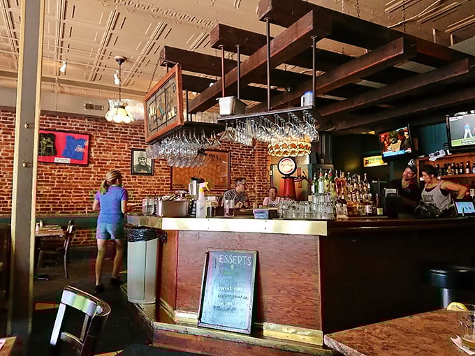 The bar area's wooden beams and hanging glassware create that "Cheers" vibe where everybody might actually know your name.
