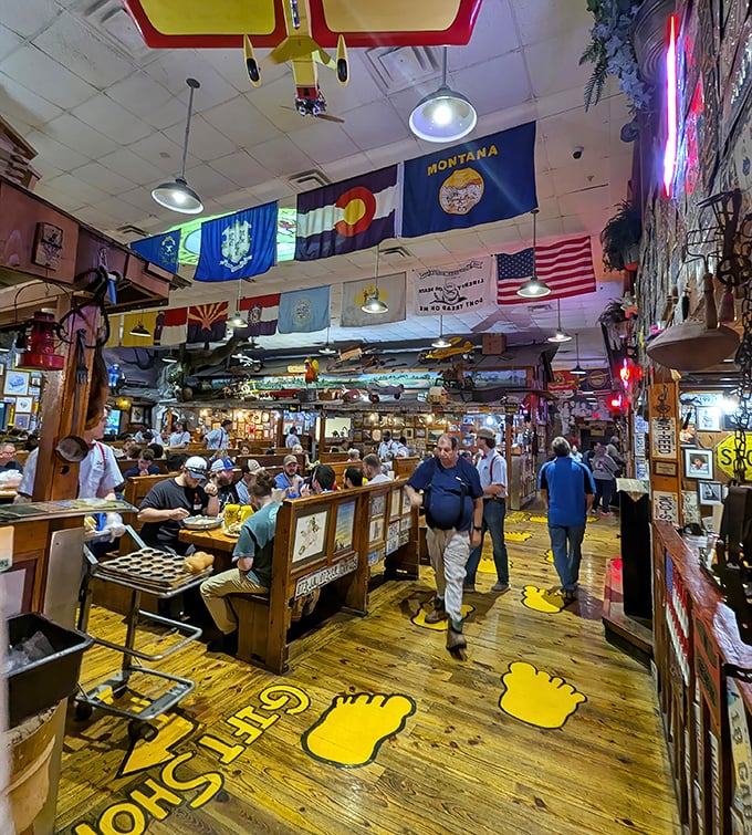 At Lambert's, the dining experience is communal—strangers become friends united by the shared adventure of catching flying carbohydrates.