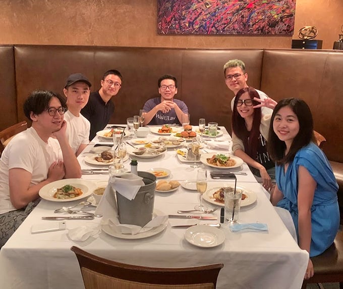 Great food becomes extraordinary when shared with friends—this table of diners creating memories that will last longer than their seafood feast.