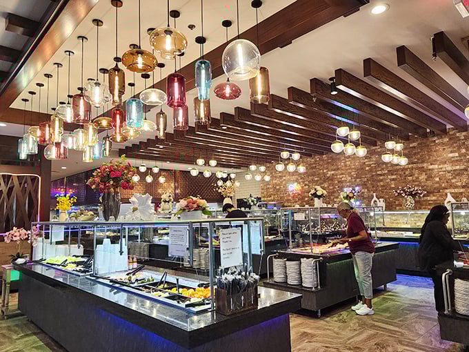 The buffet's colorful pendant lights aren't just illumination—they're conversation pieces hanging above conversations about which dish deserves an encore.
