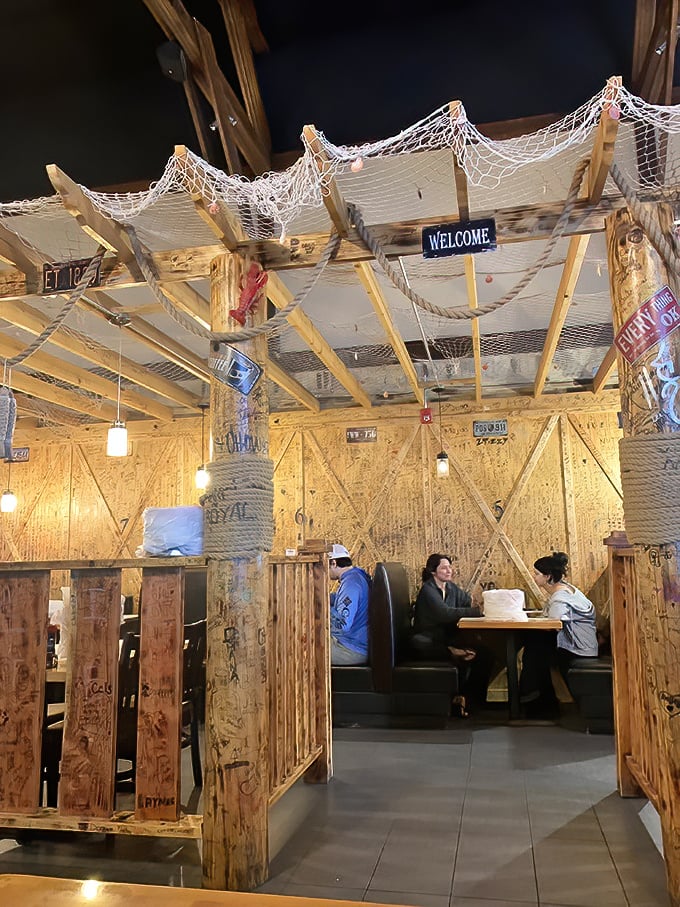 Private booths with rustic charm create the perfect setting for seafood indulgence—just don't wear your favorite white shirt.