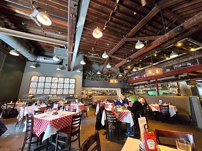 Soaring ceilings and wooden beams frame this dining room where seafood dreams come true and diet plans go to die happily.