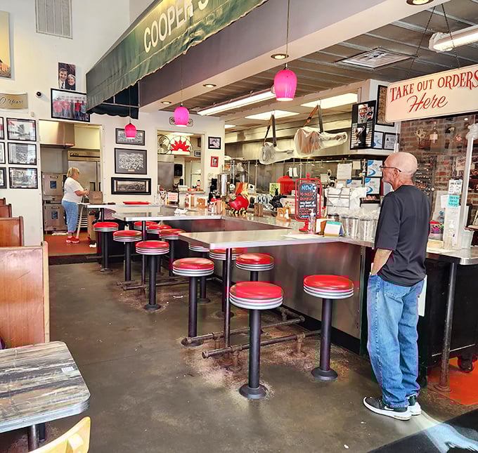 Classic diner counter seating where strangers become friends over the universal language of "mmm" and "pass the sauce, please."