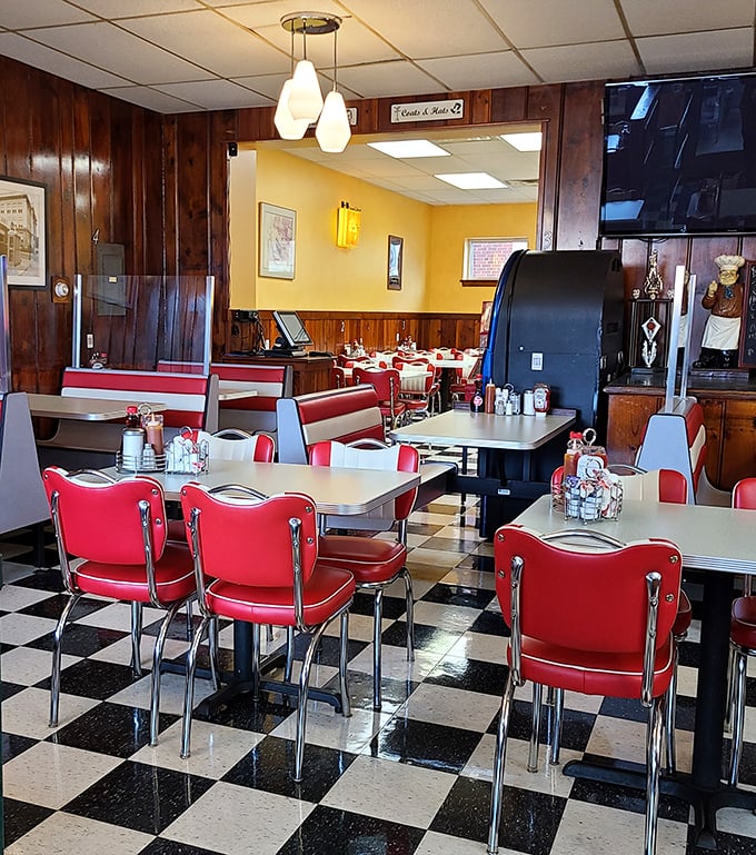 Classic diner seating that invites you to slide in and stay awhile. The pendant lights cast a glow that makes everyone look like they slept well.