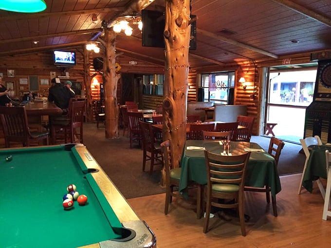 Pool sharks and food lovers find common ground here. The green felt matches the tablecloths—coincidence or brilliant design strategy?