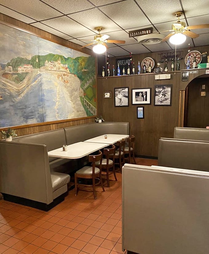 The booth seating and mural transport you to Italy without the jet lag—a corner of Cleveland that's been serving up escapism with a side of garlic bread.