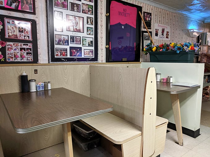 Classic booth seating and walls decorated with local memories create the cozy atmosphere chain restaurants can't replicate.