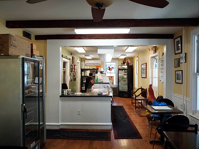 The dining area's simple layout says "we put our energy into the food," while the stained glass heart window whispers "and also into making you feel loved."