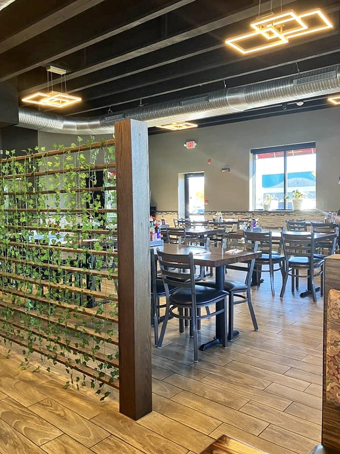 Exposed ductwork overhead, warm wood below, and the promise of Vietnamese delights everywhere—this dining room has mastered the art of atmosphere.