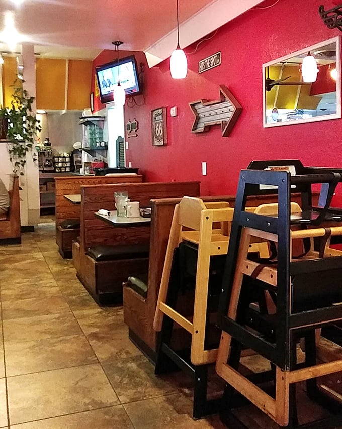 Those red walls aren't just for show—they're warning signs that the food here is serious business. High-chairs standing by for the next generation.