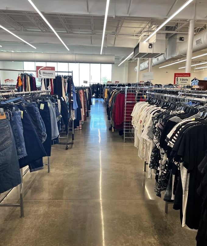 Shirts and blouses stand at attention, organized with military precision that would make Marie Kondo weep with organizational joy.
