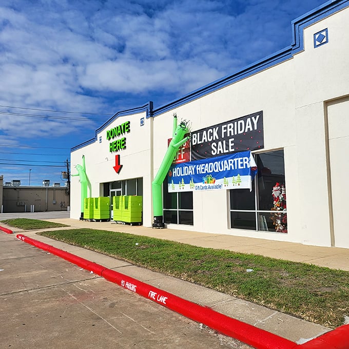 Those inflatable green tube men aren't just dancing—they're celebrating the circular economy of donations becoming someone else's treasure.