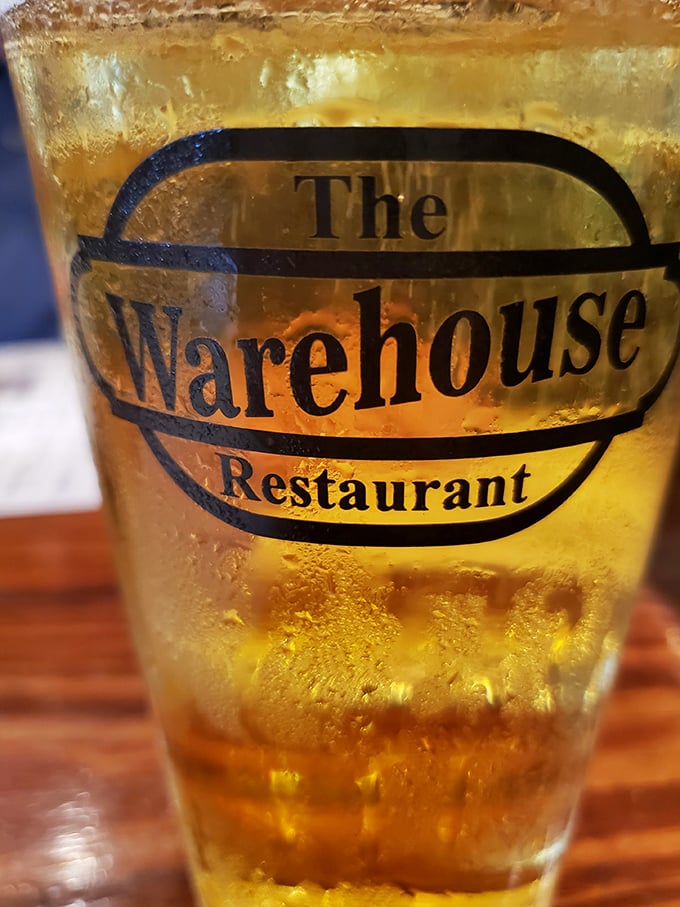 A frosty beer bearing The Warehouse logo – because sometimes the perfect beverage is the one that lets the food be the star.