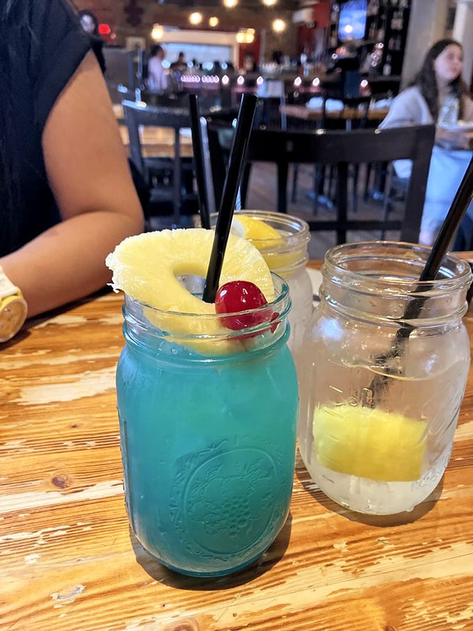 The Blue Bayou cocktail—where tropical vacation meets Southern charm in a mason jar of pure refreshment.