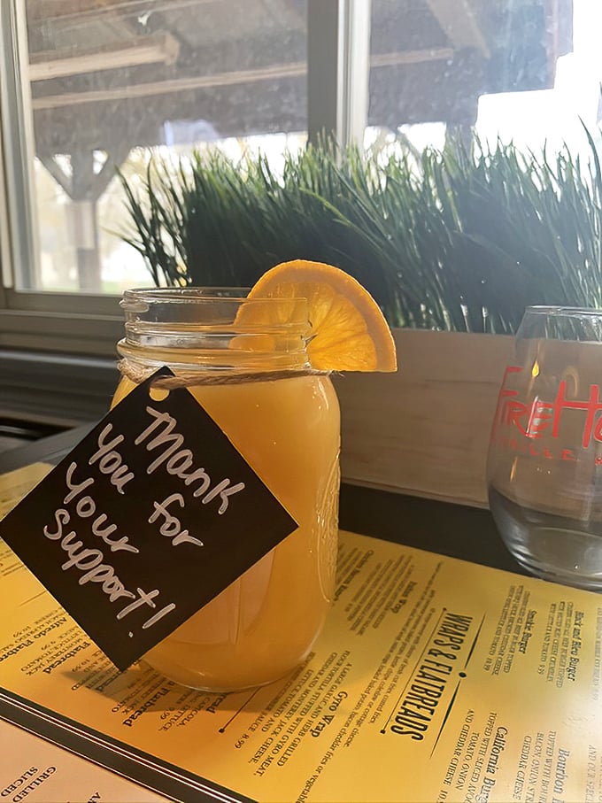 That mason jar isn't just holding a refreshing beverage—it's holding liquid sunshine with a thank-you note, because good drinks deserve good manners.
