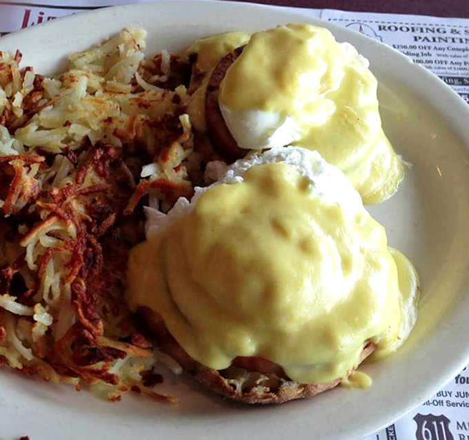 Eggs Benedict that makes morning people out of night owls—hollandaise sauce flowing like liquid sunshine over perfectly poached eggs.