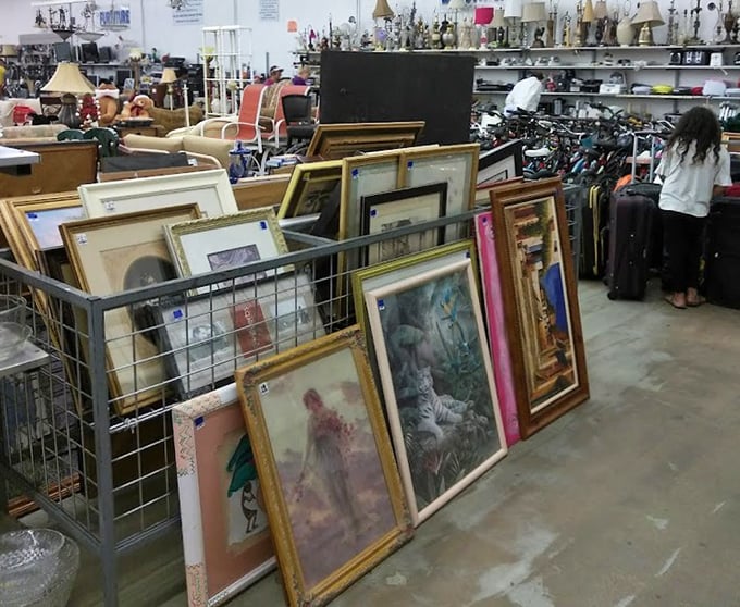 Art in limbo—frames within frames creating a gallery of forgotten masterpieces and prints that once defined someone's living room aesthetic.