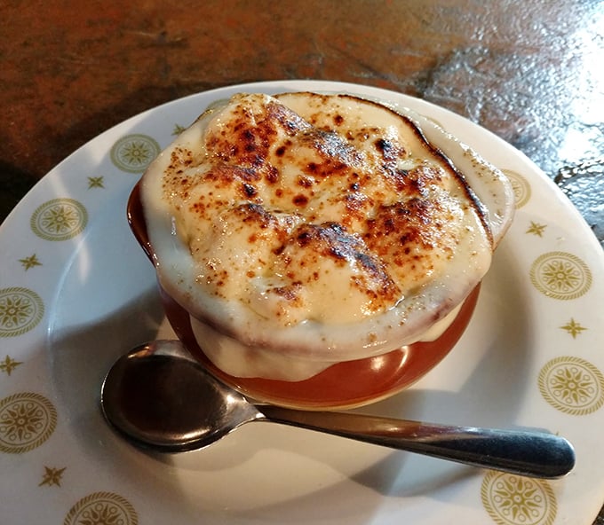 French onion soup that doesn't just warm your body—it hugs your soul under a blanket of perfectly broiled cheese.