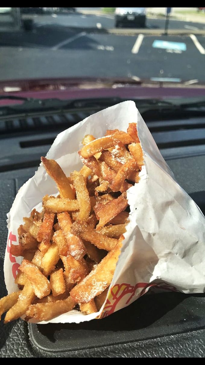 These aren't just french fries—they're golden happiness sticks, crispy on the outside, fluffy inside, and worth every napkin you'll need.
