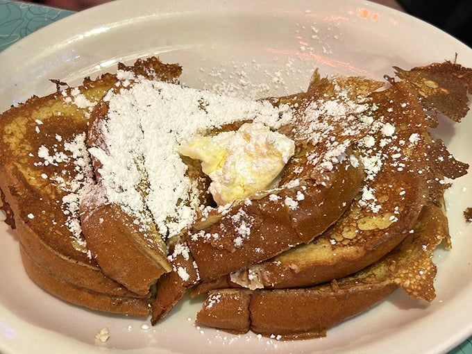 French toast that's crossed the line from breakfast to dessert, dusted with powdered sugar like San Francisco fog on a perfect morning.