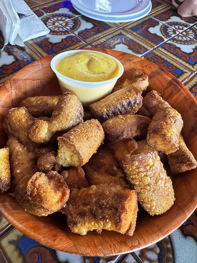 Pretzel bites that have achieved their highest purpose—fried to crispy perfection and served with a dip that demands double-dipping.