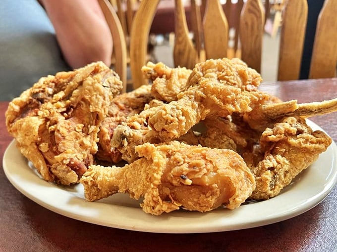 Fried chicken that's achieved the poultry equivalent of the American dream—humble beginnings transformed into golden greatness.
