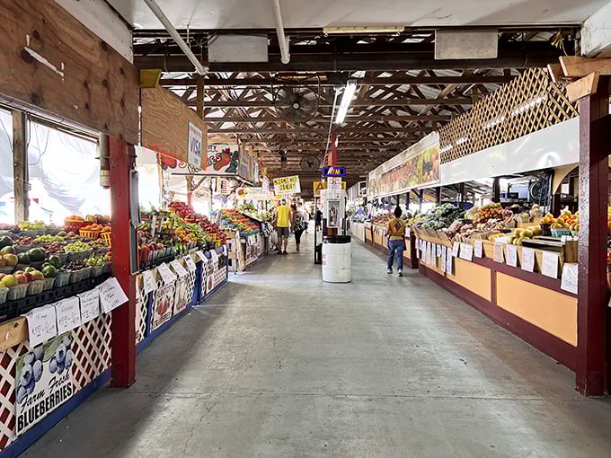 Produce paradise! This farmers market aisle showcases Florida's agricultural bounty with a rainbow of fruits and vegetables that make grocery stores seem bland by comparison.