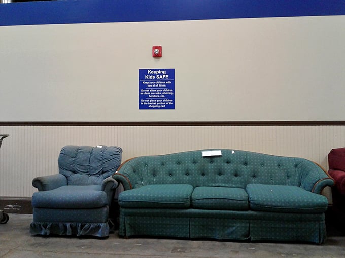 A teal sofa that's either vintage chic or your grandmother's actual couch – both options work beautifully.