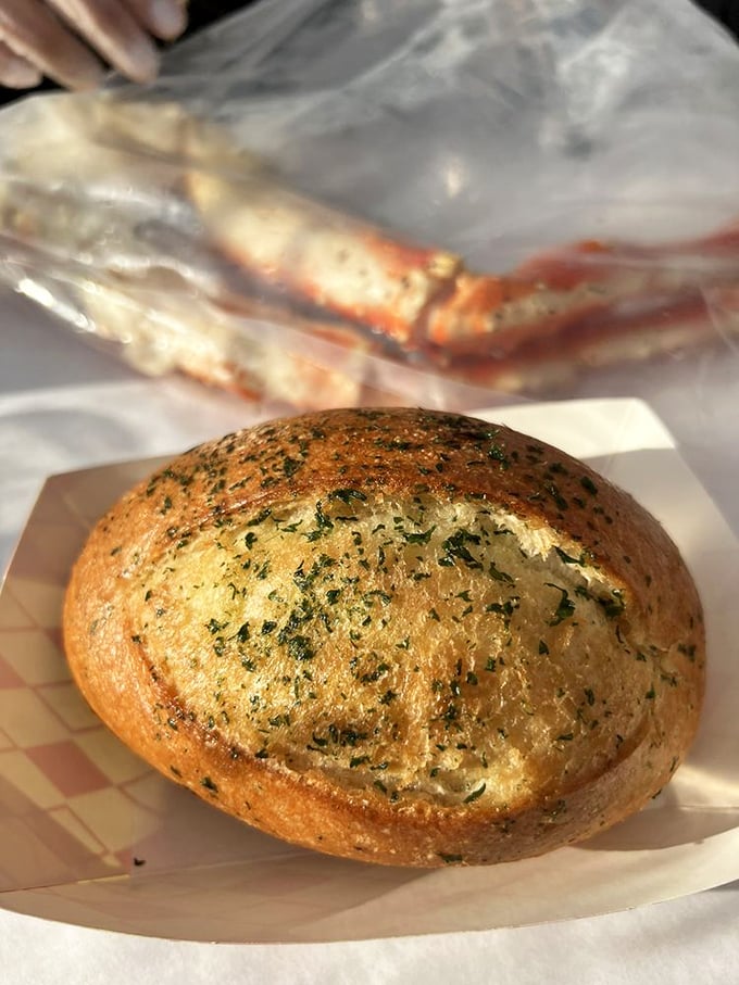 This herb-flecked garlic bread isn't just a side – it's the essential tool for soaking up every last drop of that precious seafood sauce.
