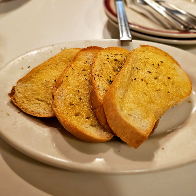Garlic bread done right – crisp edges, buttery middle, and just enough garlic to keep vampires away but not your dining companions.